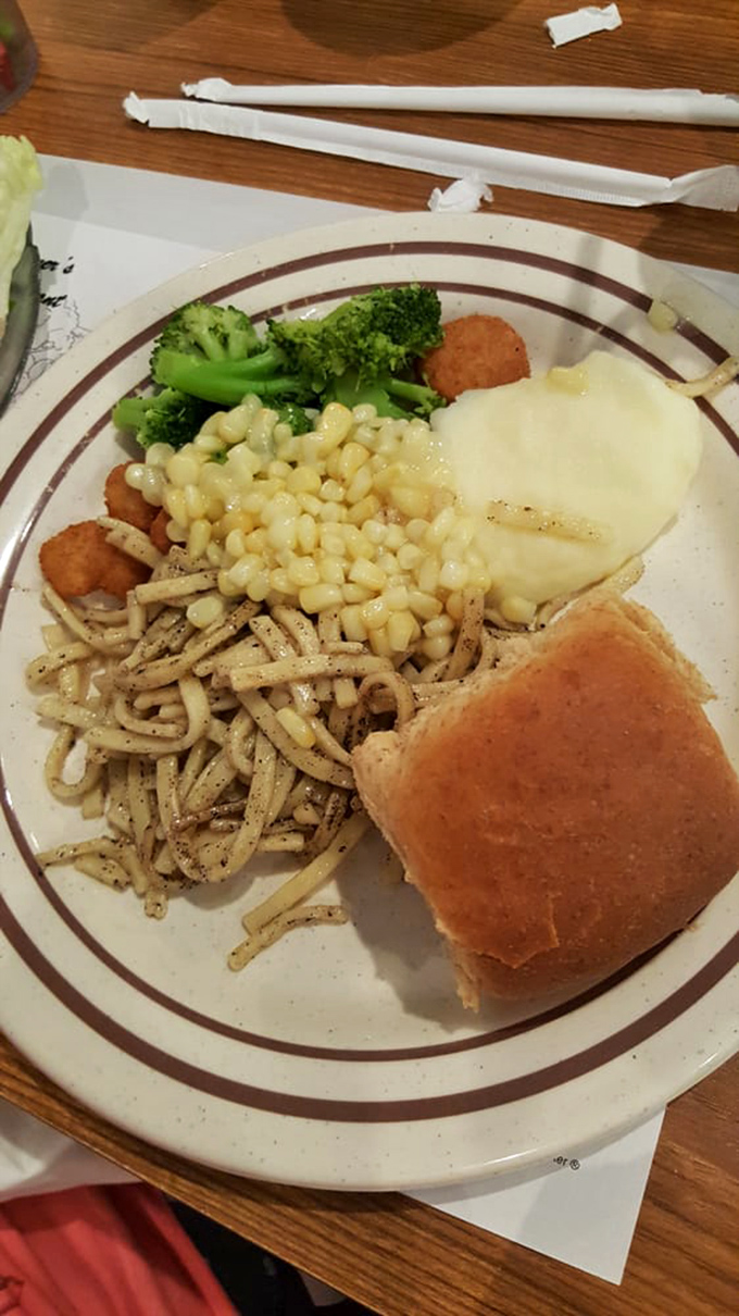 Buttered noodles, mashed potatoes, and a roll—the holy trinity of "I might need a nap after this" satisfaction.
