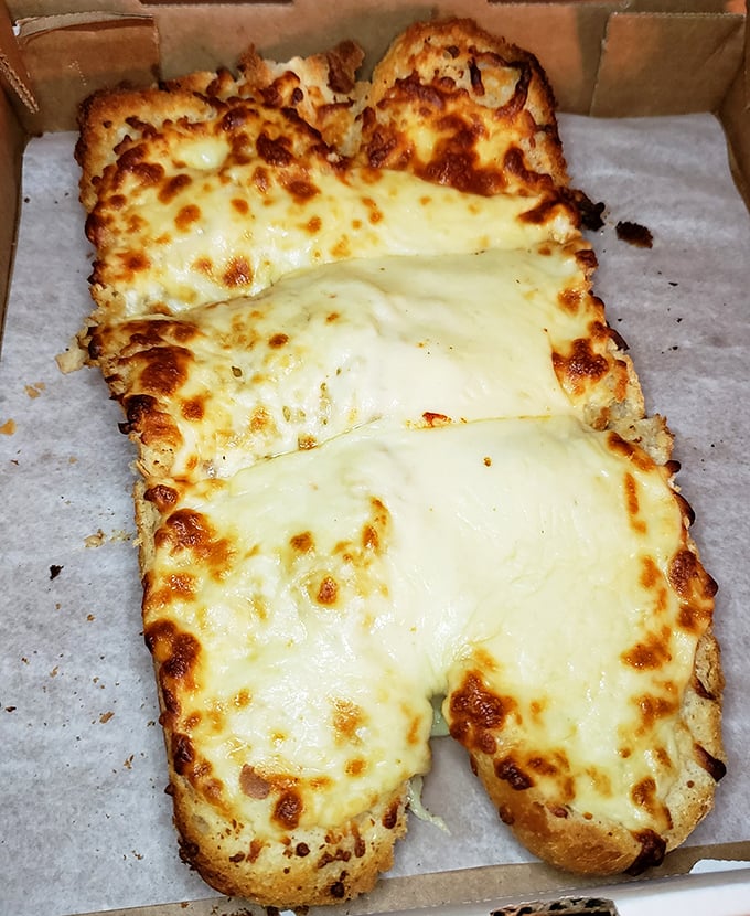 Cheesy bread that stretches the definition of "appetizer." This could be a meal itself—golden-brown, pull-apart perfection that demands to be shared. 