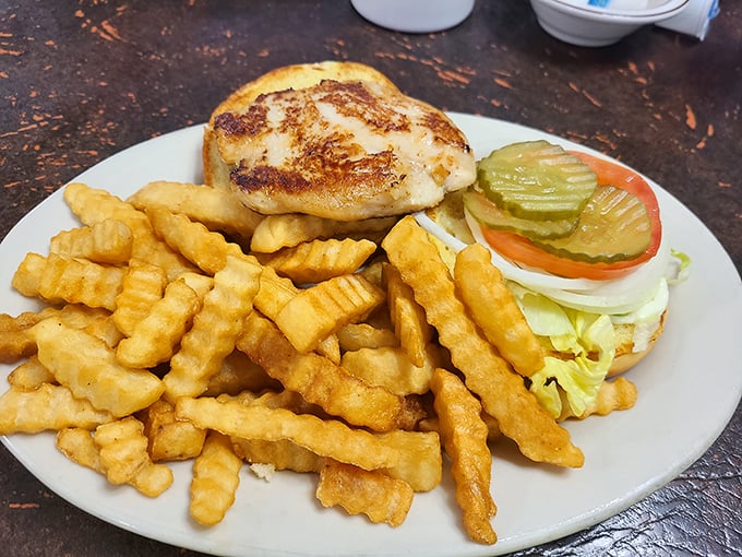 A perfectly grilled sandwich flanked by golden crinkle-cut fries—the lunch combo that's been solving midday hunger crises since before "foodie" was even a word.