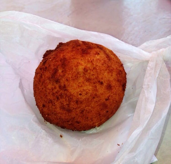 Golden-fried conch fritters – crunchy time capsules of Florida Keys flavor that demand to be savored slowly.