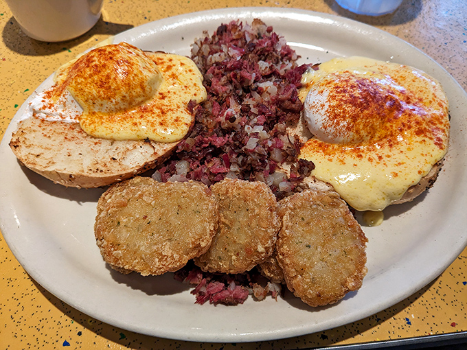 Corned beef hash crowned with eggs Benedict—proof that breakfast can be both a comfort and an adventure.