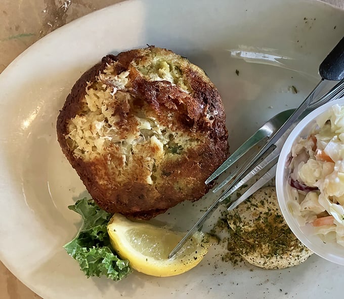This crab cake is what happens when Maryland tradition meets Florida sunshine—all crab, minimal filler, and absolutely no apologies for being deliciously straightforward.