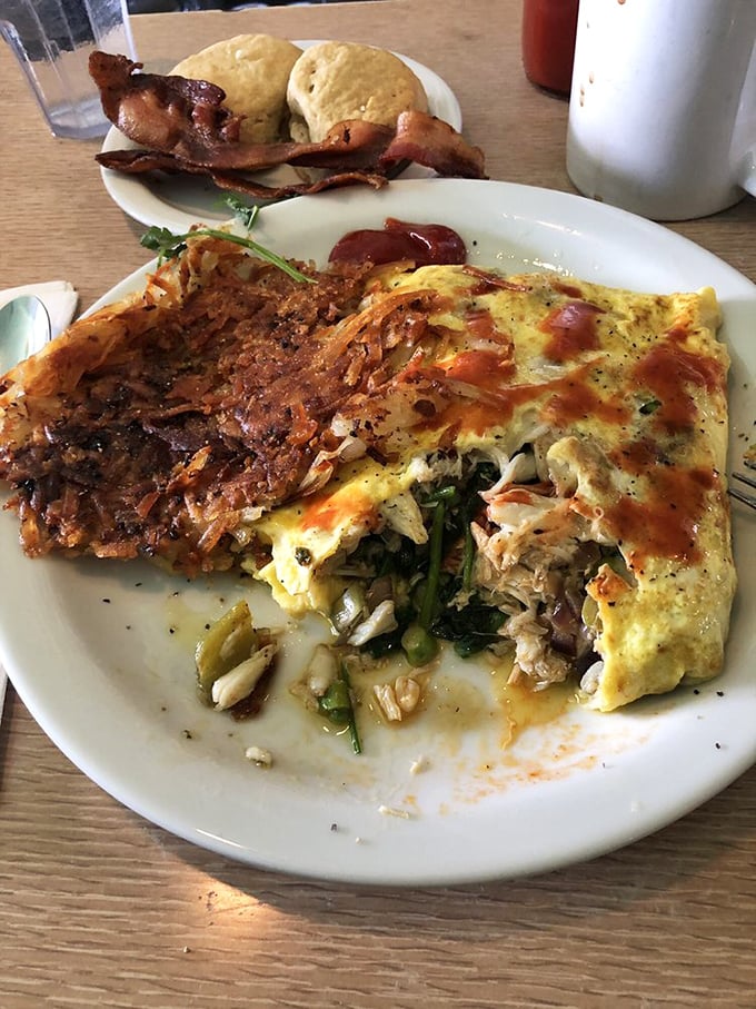 This isn't just an omelet—it's a masterpiece of eggs cradling fresh crab, with hash browns that achieve that elusive crispy-outside, tender-inside perfection.