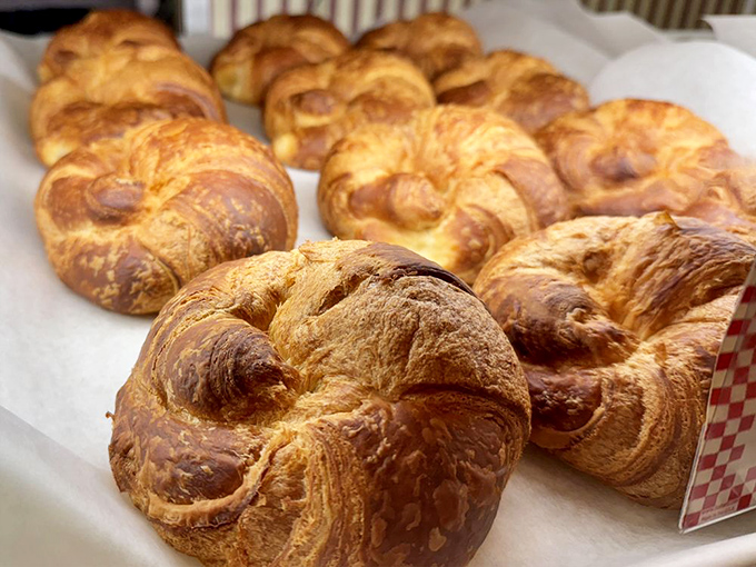 Golden croissants with that perfect honeycomb interior—the kind that make you understand why people line up at dawn. Butter's greatest achievement.