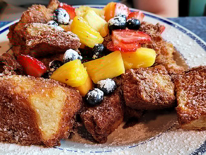 French toast that's had a Caribbean vacation—golden, cinnamon-dusted islands surrounded by a sea of colorful fruit. Passport not required.