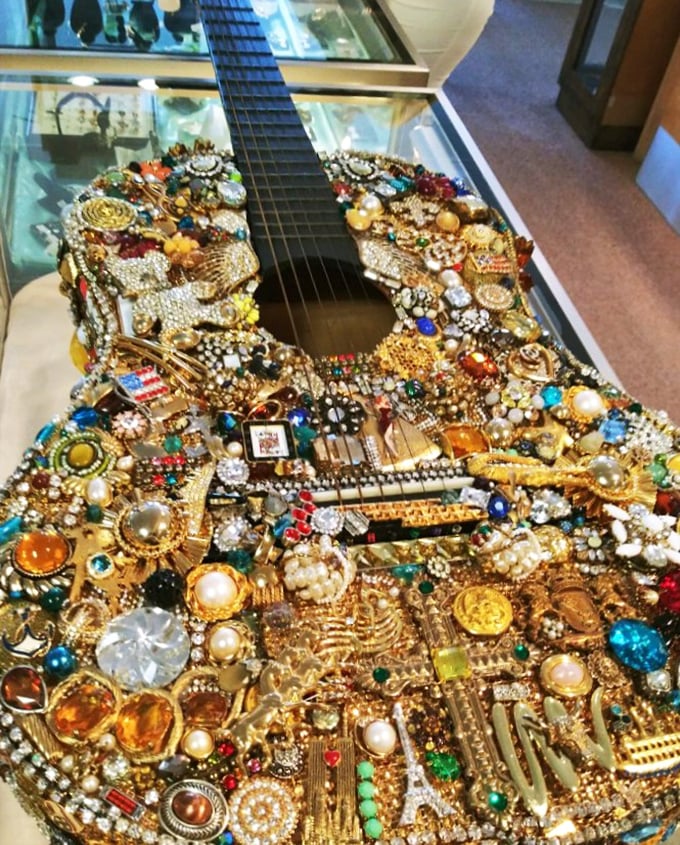 Not your average six-string! This bejeweled guitar transforms costume jewelry from grandma's drawer into a glittering homage to rock and roll.