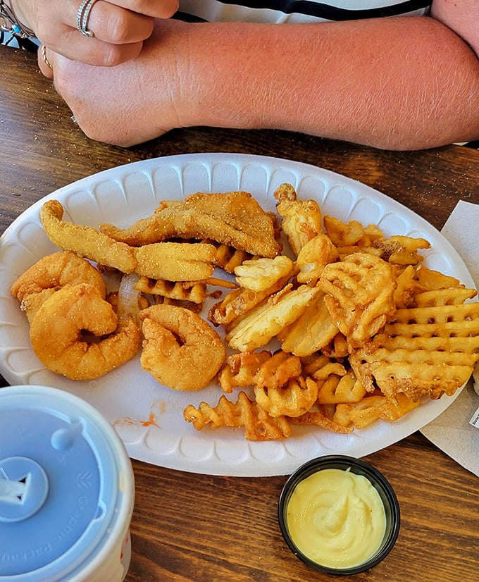 These golden-fried shrimp and crispy fries aren't just food; they're edible sunshine paired with a local brew that tastes like vacation.