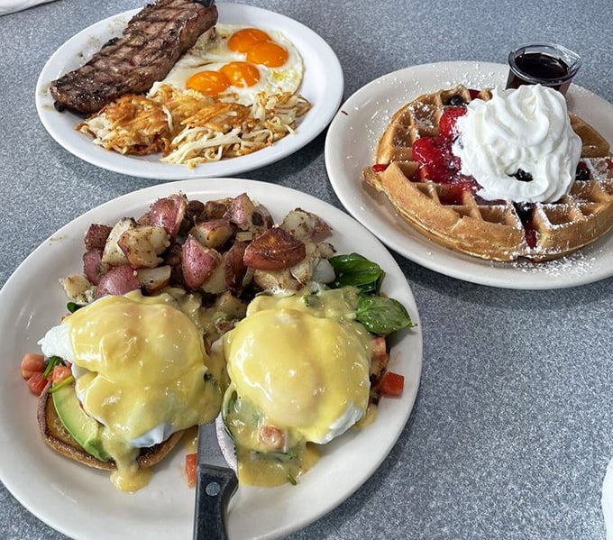 A breakfast spread that covers all the bases—savory eggs Benedict, classic steak and eggs, and a waffle that's dressed for success with berries and cream.