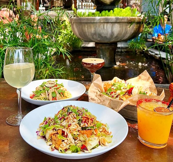 Garden-fresh salads and colorful cocktails served alongside a tranquil fountain – like dining in your fantasy backyard that you'll never have to weed.