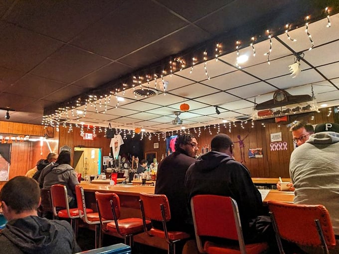 The bar at George's—where strangers become friends and friends become family, all under the warm glow of string lights. 