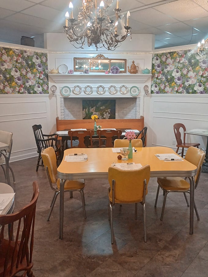 The cafe's retro-chic dining area, where floral wallpaper and elegant chandeliers create the perfect backdrop for both antiquing breaks and serious meal missions.