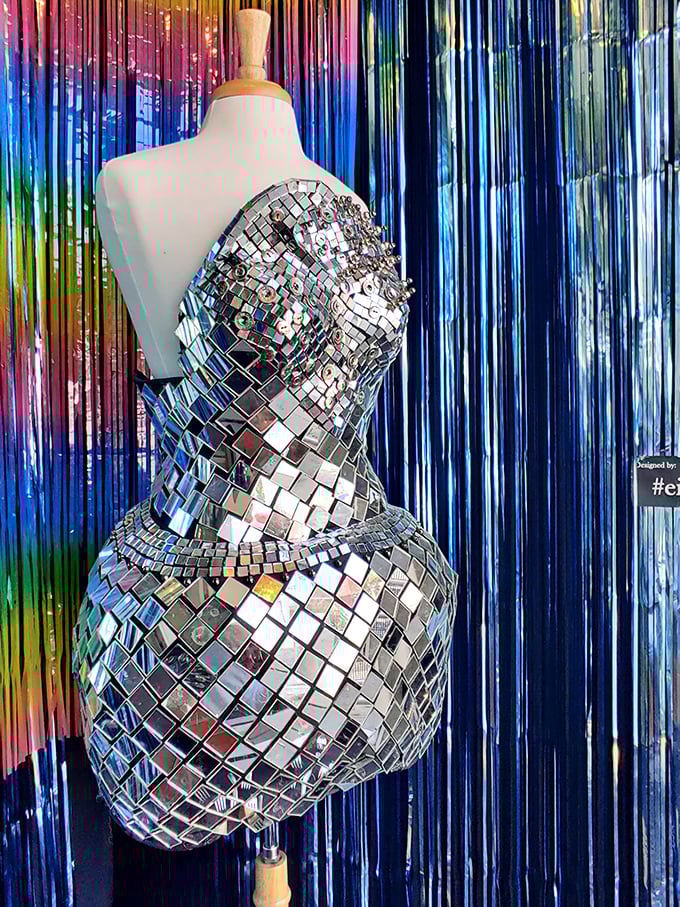 Studio 54 called—they want their dress back. This mirror-tiled masterpiece transforms any wearer into a walking disco ball.