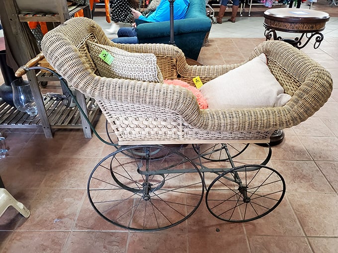 This antique wicker baby carriage isn't just furniture—it's a time machine to an era when strollers had character and craftsmanship.