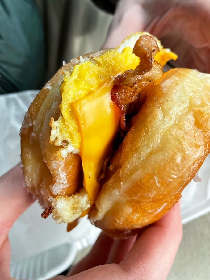 Breakfast innovation at its finest: a glazed donut sandwich with egg, cheese and bacon that makes you question all your life choices—in the best way.