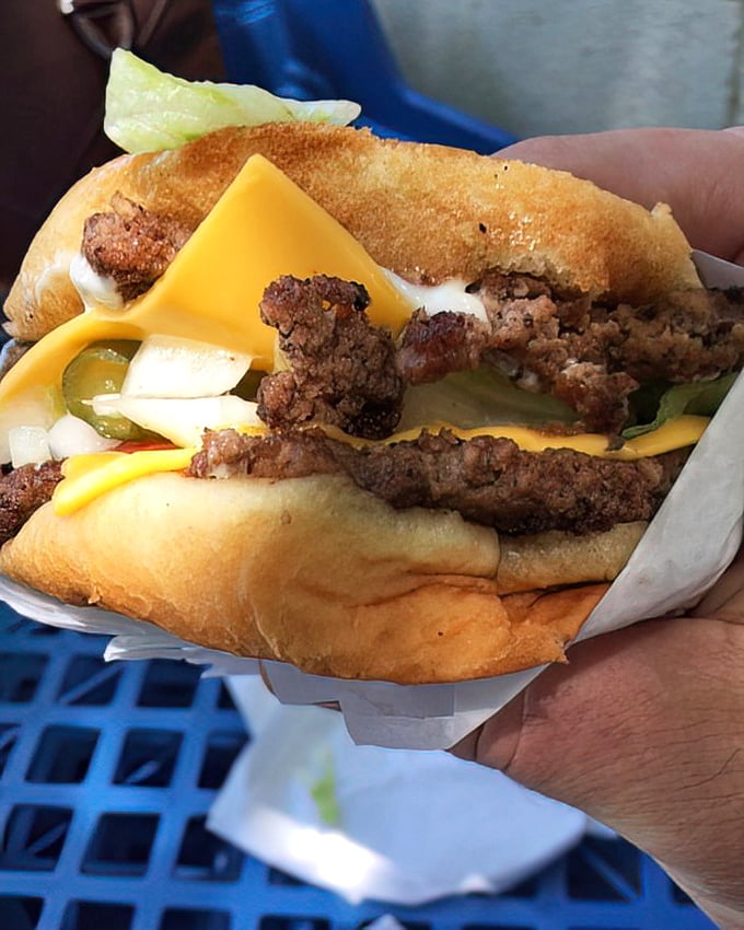 The double double doesn't just satisfy hunger—it obliterates it, with those twin patties and double cheese creating a flavor symphony that makes fast food chains weep with inadequacy.