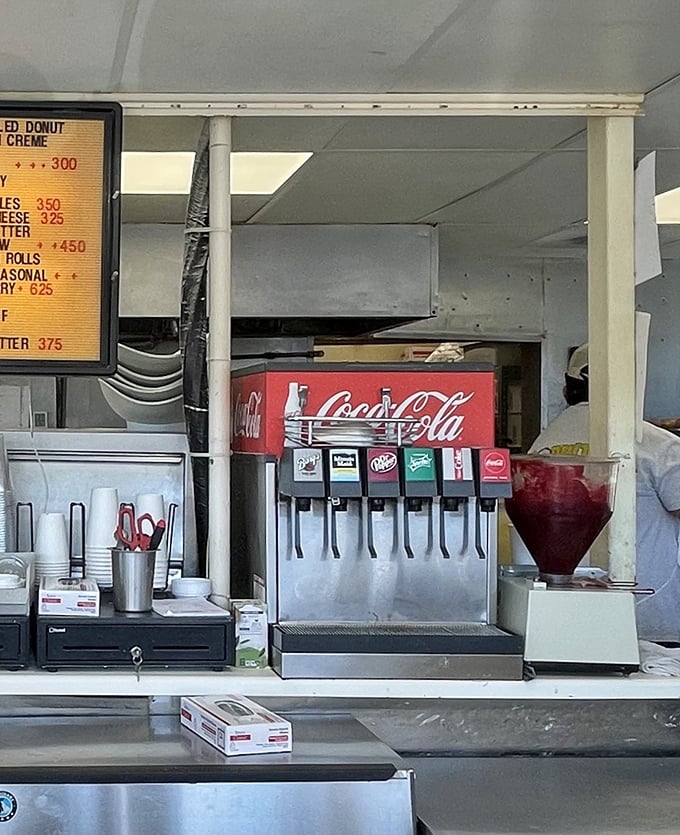 The soda fountain and coffee station – humble companions to the star attractions, offering the perfect liquid sidekick to your donut adventure.