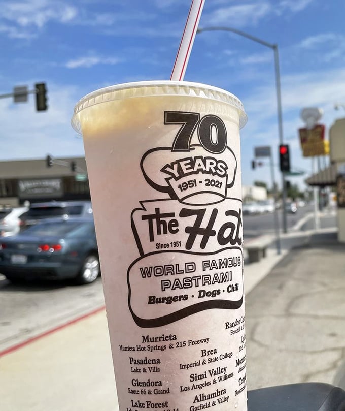 That 70th anniversary cup isn't just holding a beverage—it's containing seven decades of California food history in convenient sippable form.