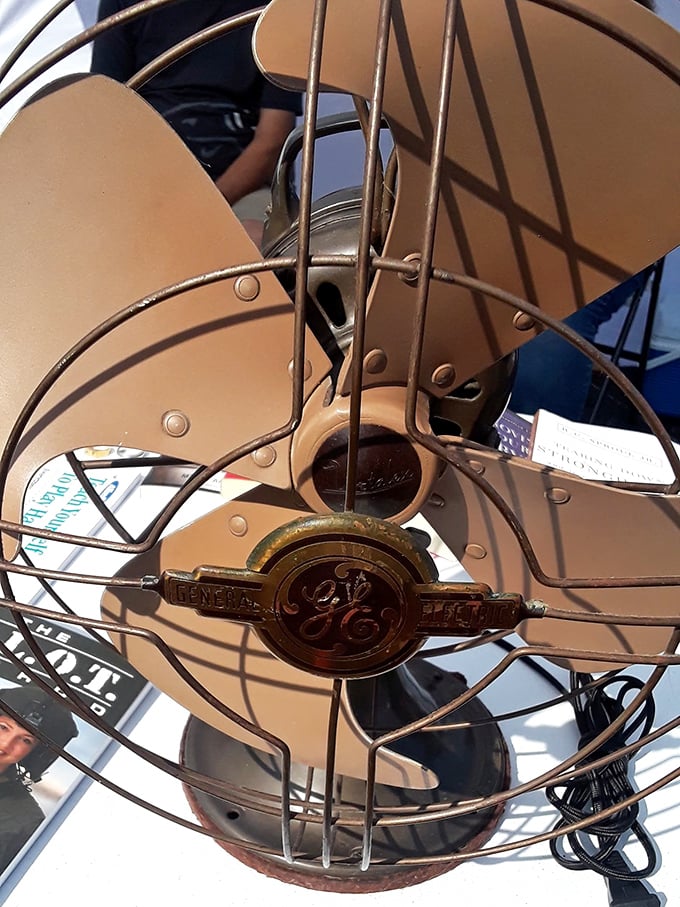 This vintage GE fan isn't just blowing hot air – it's a perfectly preserved piece of mid-century cooling technology that still looks ready to whirl.