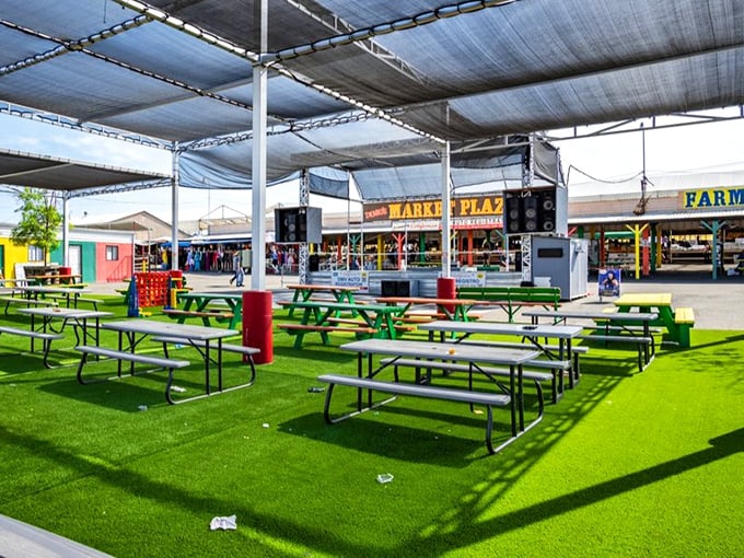 The food court—where picnic tables await beneath merciful shade and the only tough decision is which international cuisine to try first.