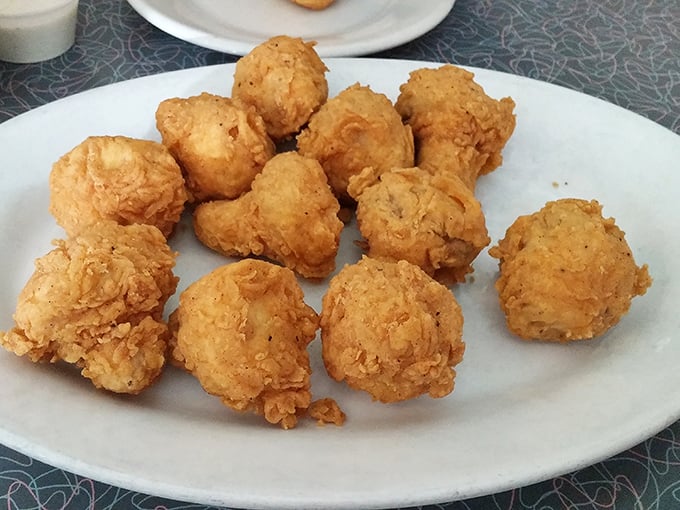 These golden-fried mushrooms aren't just appetizers—they're little orbs of happiness that disappear from plates with suspicious speed.