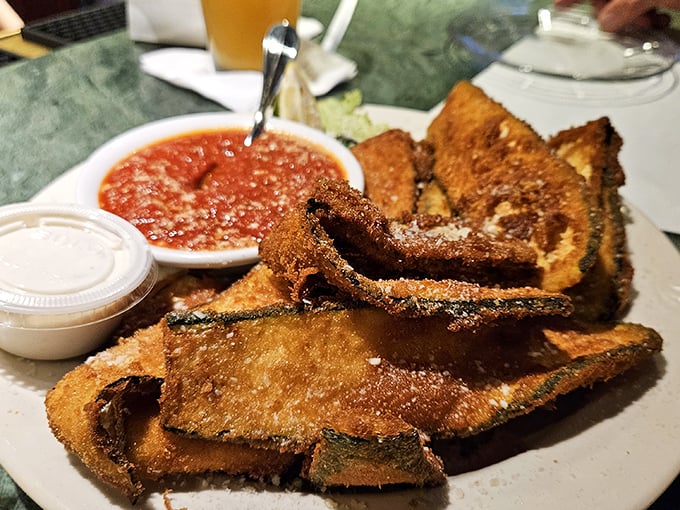 The legendary fried zucchini—crispy on the outside, tender within. This isn't just bar food; it's the reason people drive across county lines.