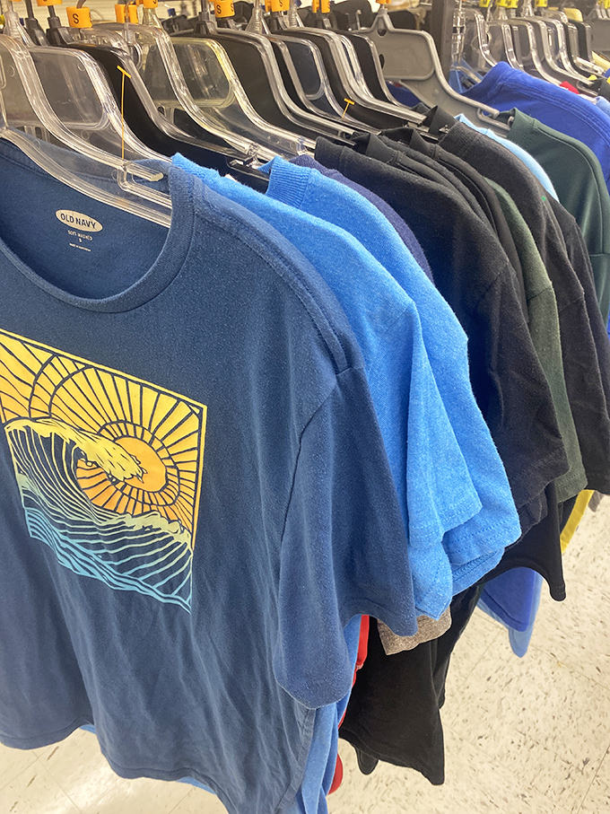 T-shirt racks burst with color and graphic designs—that blue one with the sunset might just be your next favorite weekend wear.