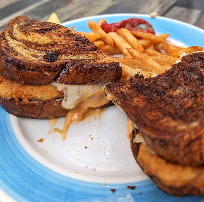 This isn't just a sandwich—it's Florida architecture: perfectly constructed layers of golden-grilled bread supporting a melty masterpiece within.