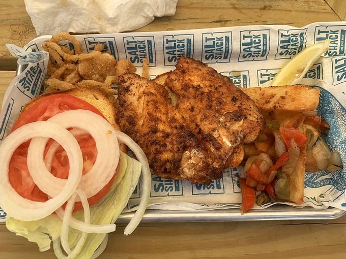 The grouper sandwich that launched a thousand return visits—perfectly seasoned, expertly cooked, and impossible to replicate at home.