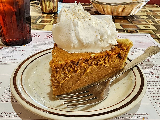 Pumpkin pie topped with a cloud of whipped cream—autumn on a plate, regardless of what season it actually is outside.