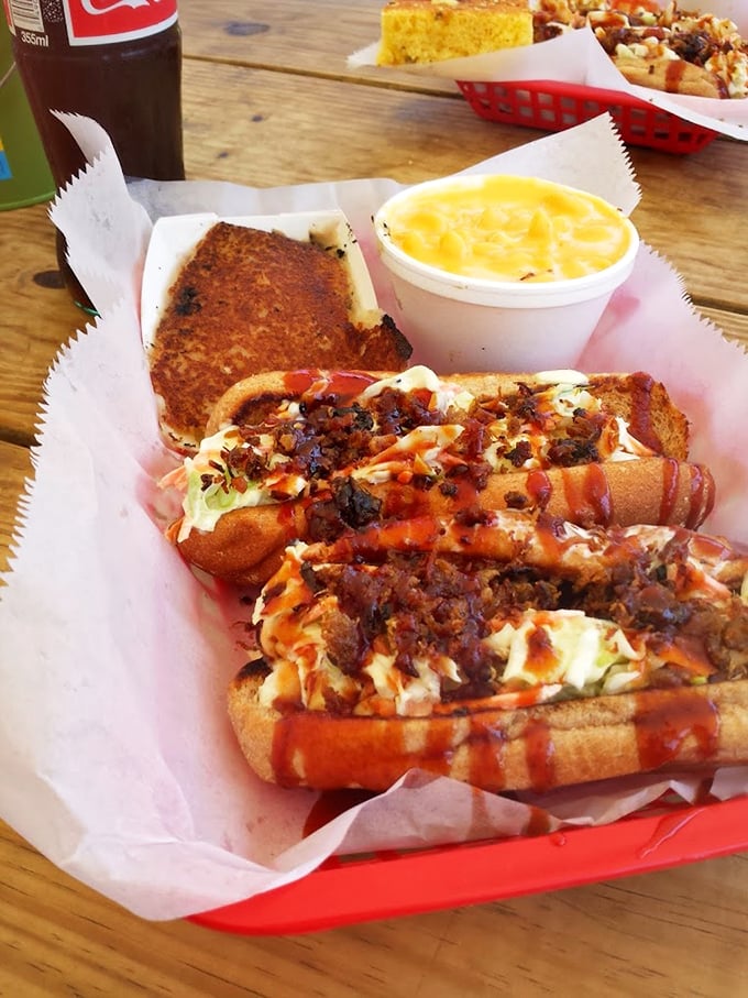That pulled pork sandwich with slaw and sauce is what happens when simple ingredients meet smoke mastery – pure Ohio barbecue bliss.