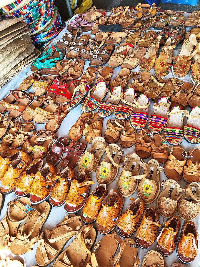 Handcrafted huaraches spread like a leather garden. These traditional Mexican sandals offer both cultural heritage and blister-free summer style in one beautiful package.