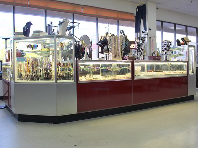 The jewelry counter gleams with possibility – vintage brooches and contemporary pieces waiting to become your "I can't believe it was thrifted" humble brag.