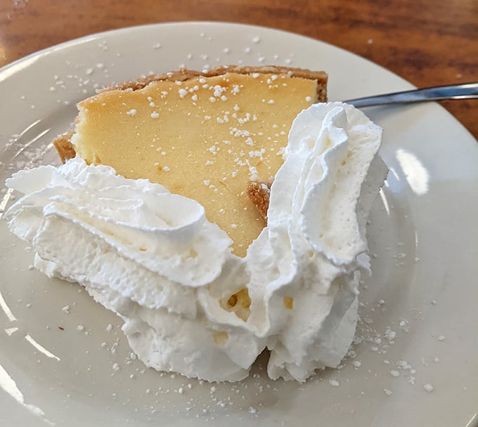 The star of the show—key lime pie with clouds of whipped cream that makes you question why you'd ever waste calories on lesser desserts.