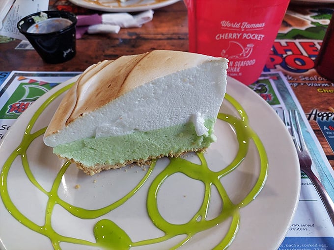The star of the show: key lime pie with that perfect pale green hue—authentic Florida on a plate, crowned with a cloud of whipped cream.