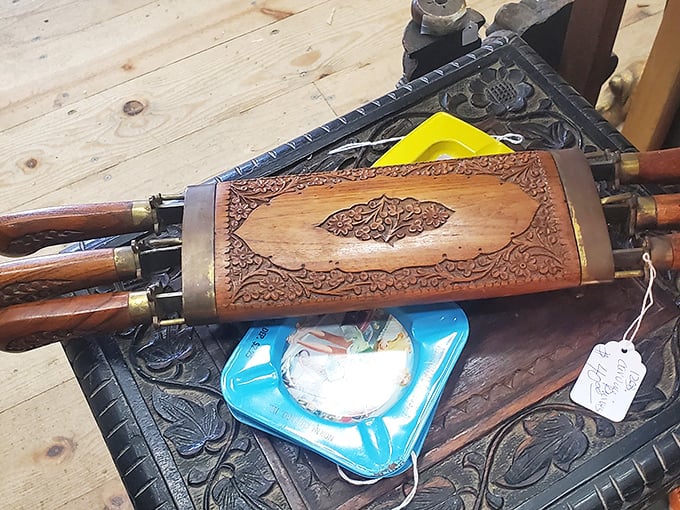 This intricately carved wooden bellows isn't just a tool—it's functional art from an era when even everyday objects deserved beautiful craftsmanship.