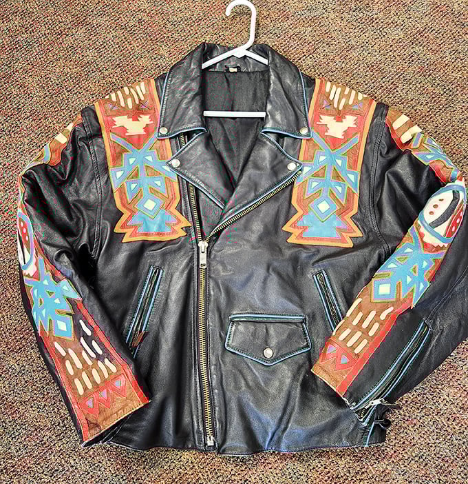 This southwestern-inspired leather jacket isn't just vintage clothing—it's wearable art with stories etched into every colorful geometric pattern.