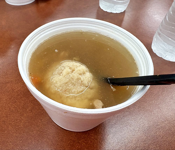Matzo ball soup that could cure whatever ails you, floating like delicious clouds in golden broth.