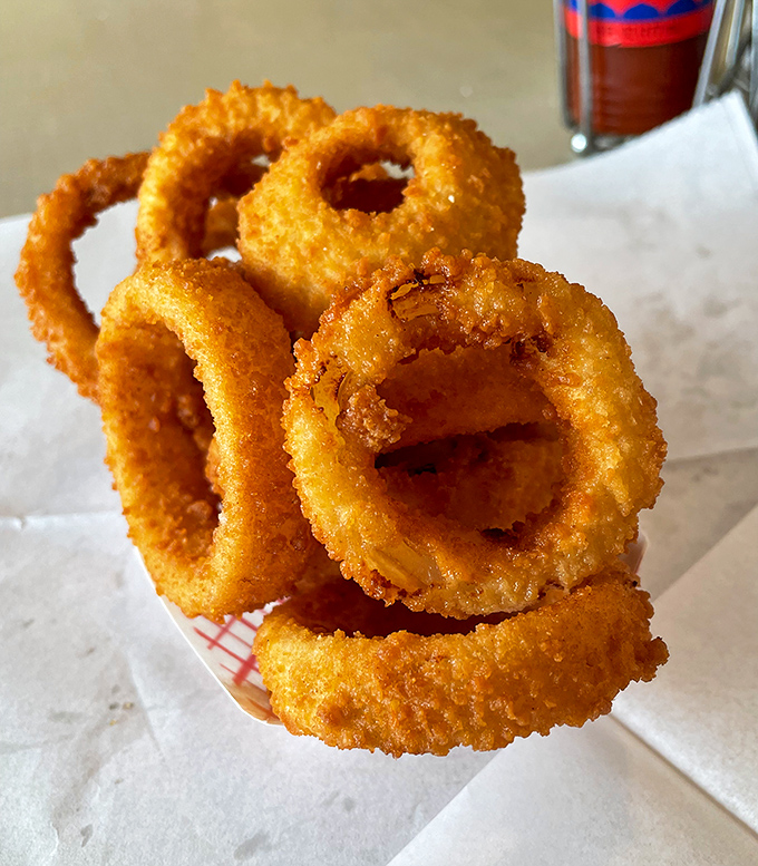 Onion rings with the structural integrity of Olympic gold—crispy armor protecting sweet, tender onion within. Worth every calorie and then some.