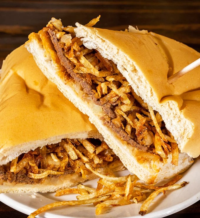 Cut this frita in half and watch the cross-section reveal the perfect stratification of beef, potatoes, and bread—it's edible geology at its finest.