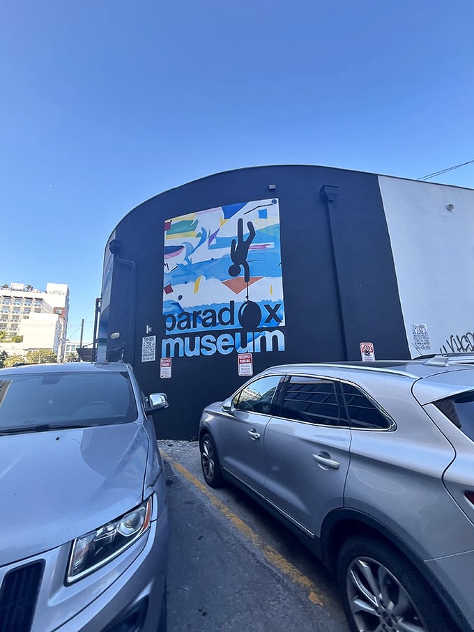 Don't let the unassuming exterior fool you—behind this wall lies a wonderland of optical illusions that will flip your understanding of reality.