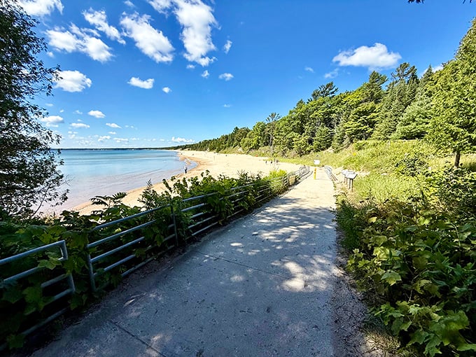 The boardwalk to bliss. This accessible path guides visitors through dune grasses to reveal the park's crown jewel—a pristine Lake Michigan beach.