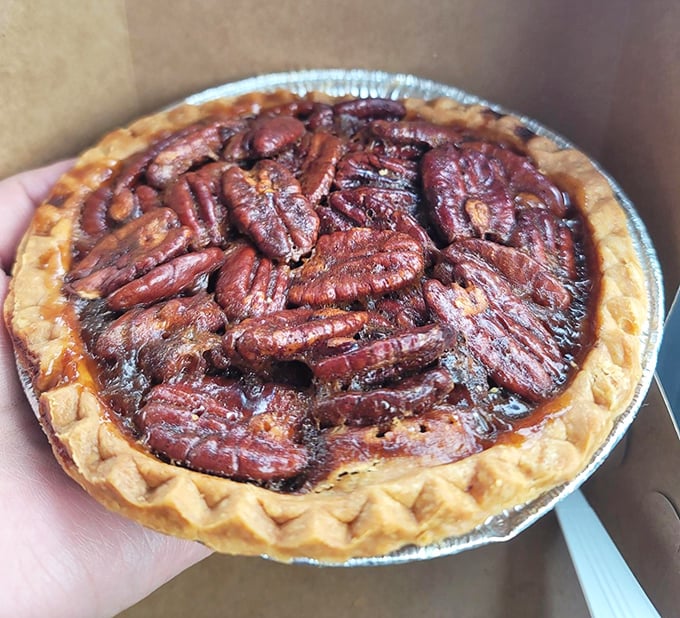 Pecan pie perfection – where buttery crust cradles a symphony of nuts and sweet filling that would make even the most stoic Midwesterner shed a tear.
