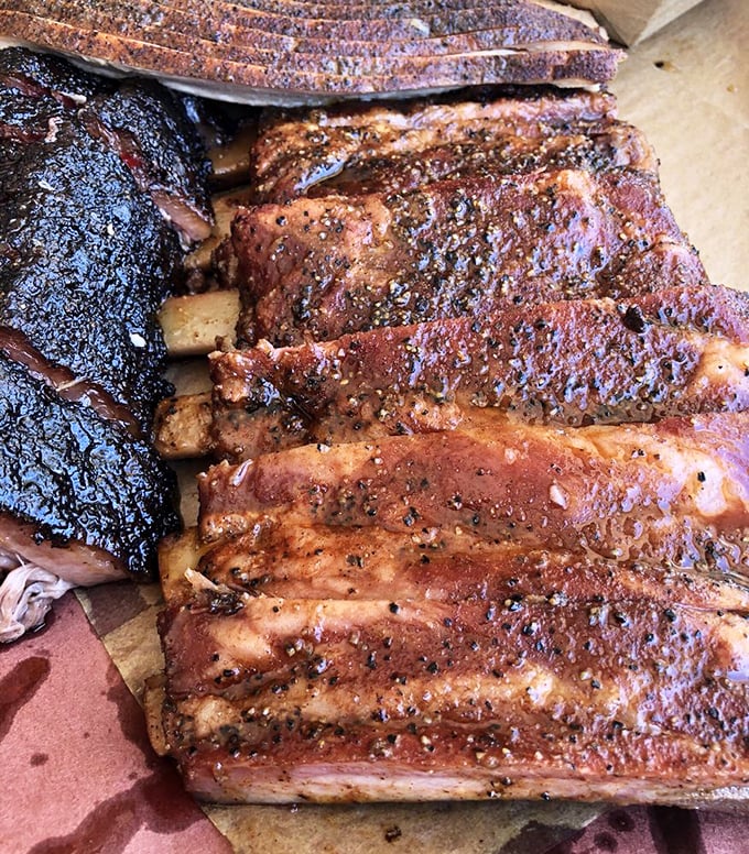These ribs have the kind of bark that doesn't bite – unless you count the gentle nip of perfectly balanced spices that keep you coming back for more. 