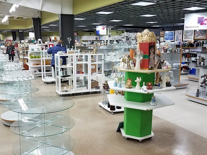 Organized chaos at its finest—shelves of glassware and decorative items create a domestic archeological dig for patient browsers.