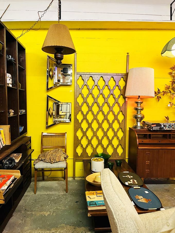 Mid-century modern meets sunshine yellow in this retro vignette. Don Draper would approve of that room divider—perfect for hiding your Old Fashioned.
