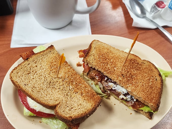 A sandwich that requires strategy to eat. Crispy toast, fresh veggies, and layers of meat stacked higher than Florida's humidity.