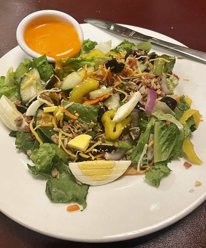 This isn't just a salad—it's a colorful convention where vegetables, cheese, and egg have gathered to discuss important matters of taste and texture.