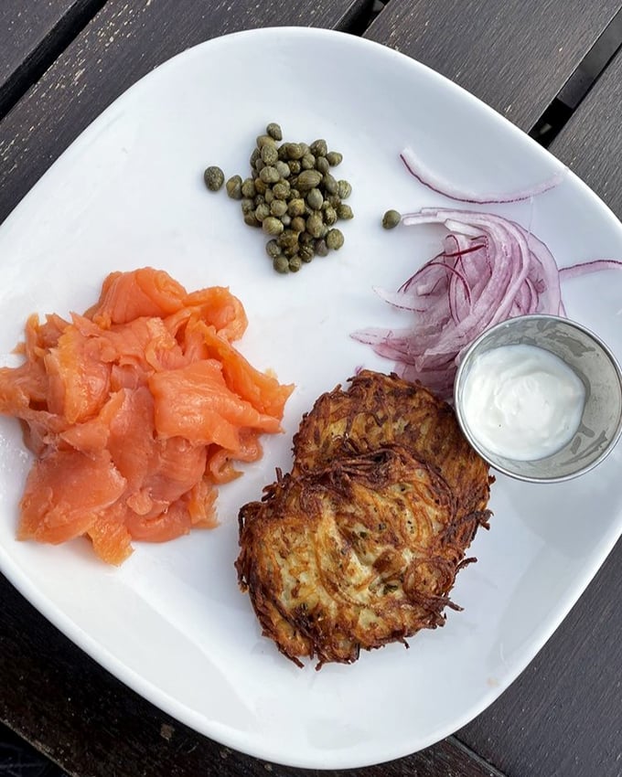 Potato latkes and smoked salmon—the power couple of brunch. That crispy potato pancake deserves its own fan club.