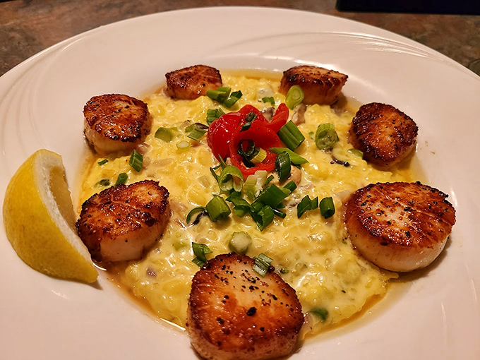 These seared scallops nestled in creamy risotto look like they're having a better day than I am. Caramelized perfection with a buttery center—the seafood equivalent of a standing ovation.