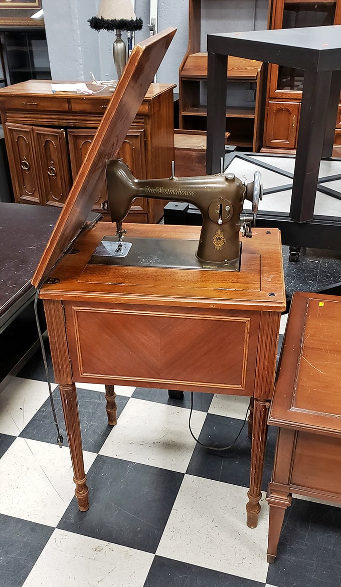 A vintage Westinghouse sewing machine stands ready for its second act—the Meryl Streep of household appliances, still stunning after all these years. 